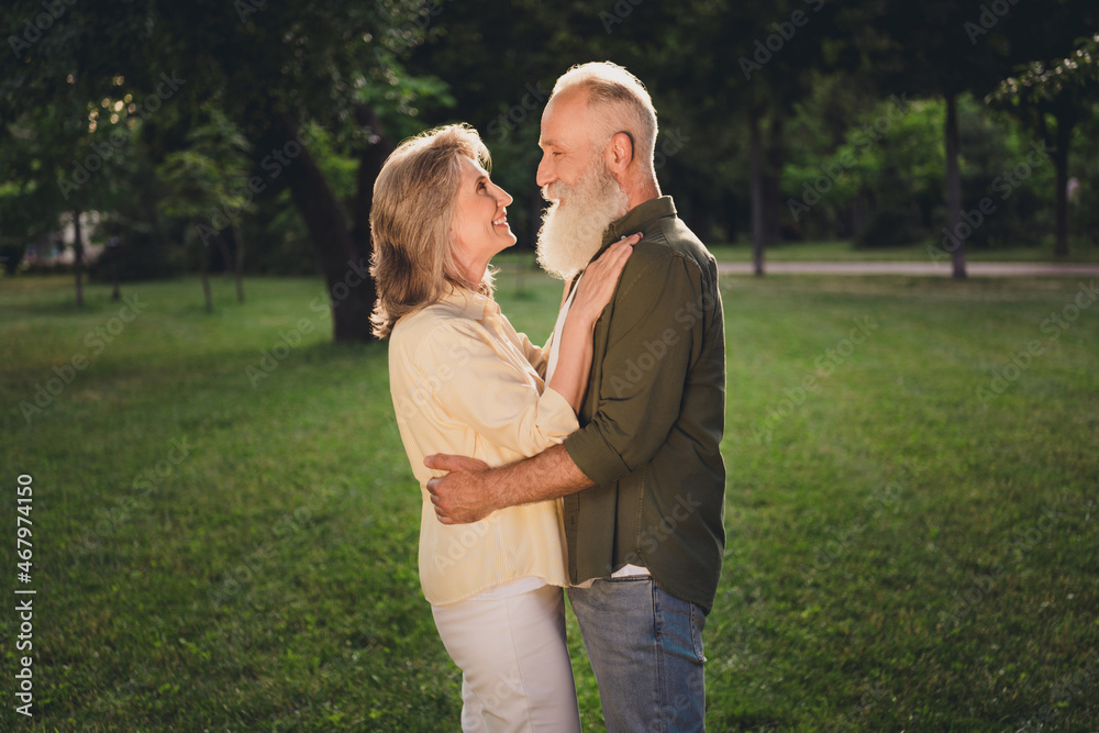 Profile photo of flirty emotion pensioner grey hair couple hug wear ...