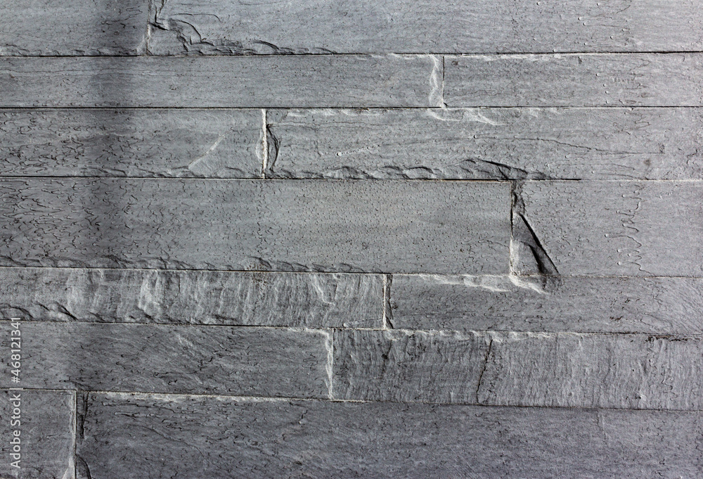 Grey wall tiles imitating brickwork. Modern finishing material. Gray ...