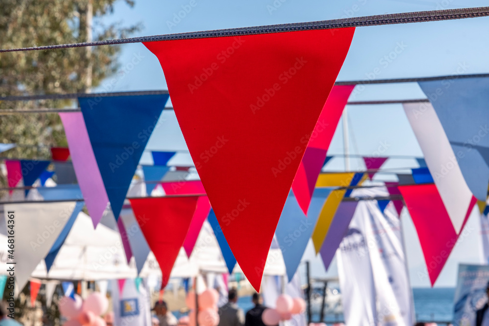 Colorful pennants at day light. Multicolored bunting triangular shape ...