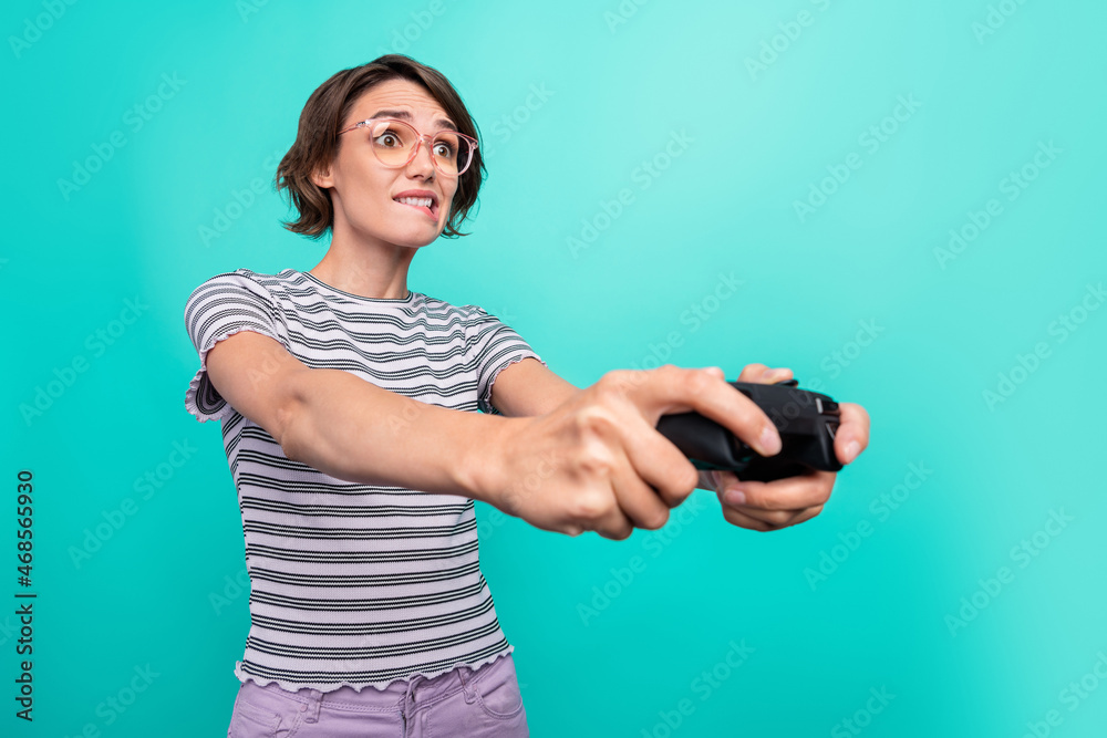 Profile side photo of young girl race speed bite lips worried play game ...