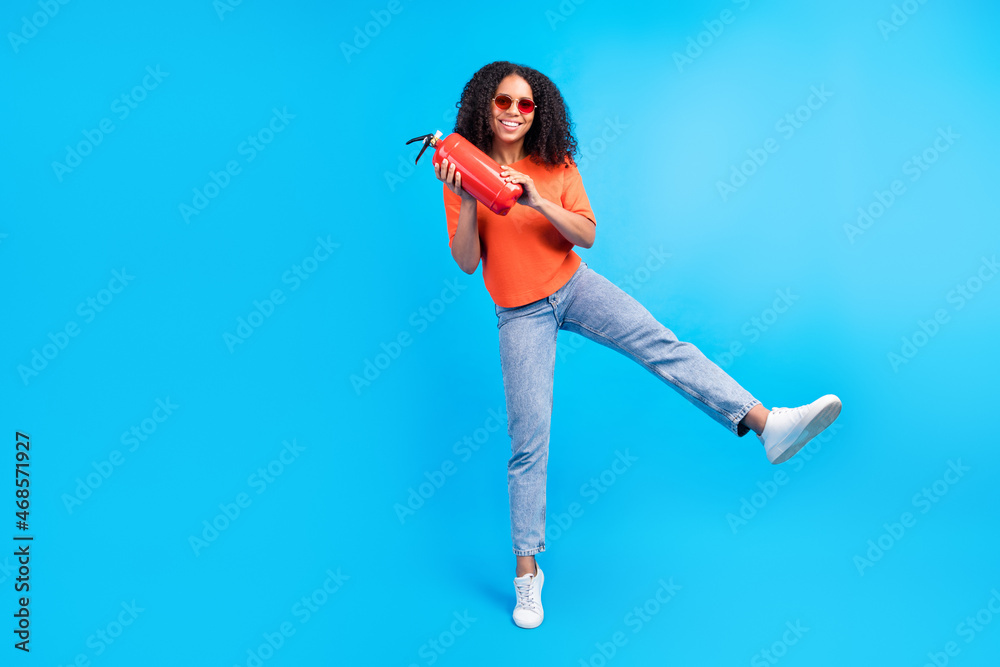 Full size photo of young african woman happy positive smile hold fire ...