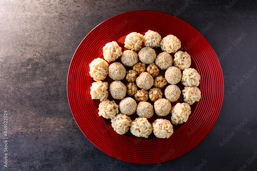 Til ladoo peanut chikki Murmura laddu Revdi popcorn Indian festival ...