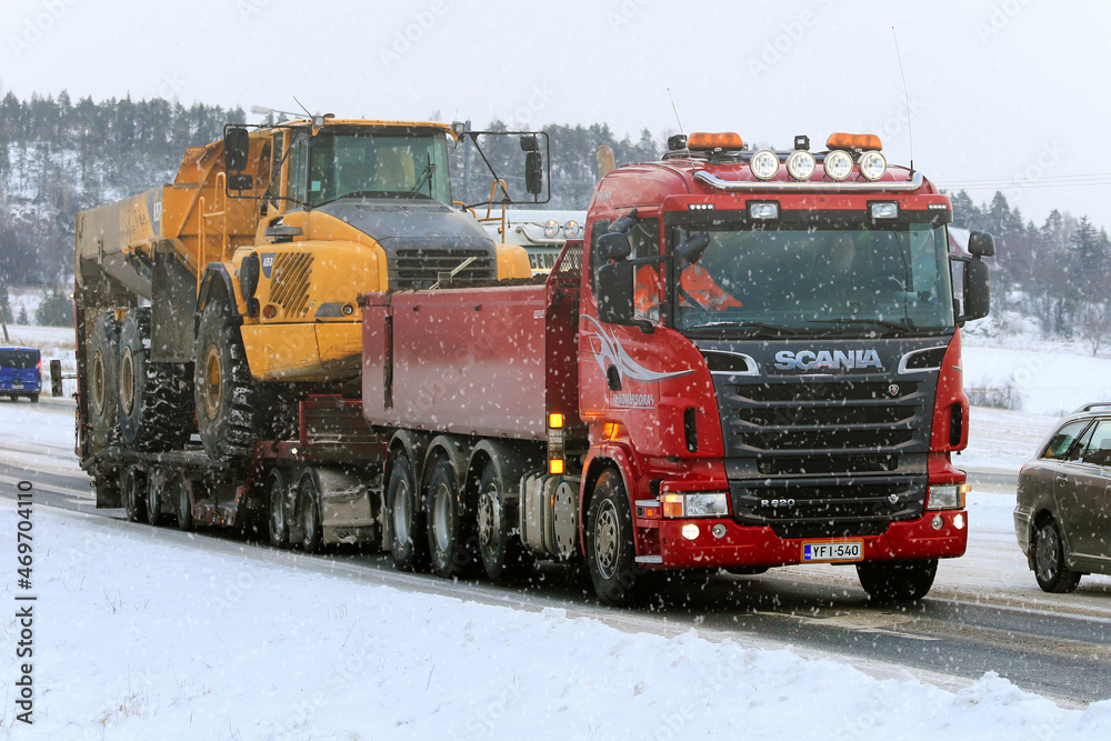 Red Scania Truck Transports Volvo Articulated Hauler in Winter Snowfall ...