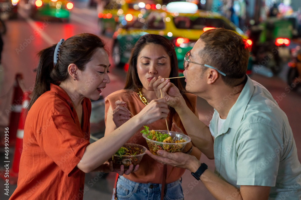 Group of Asian woman and LGBTQ people friends tourist enjoy eating ...