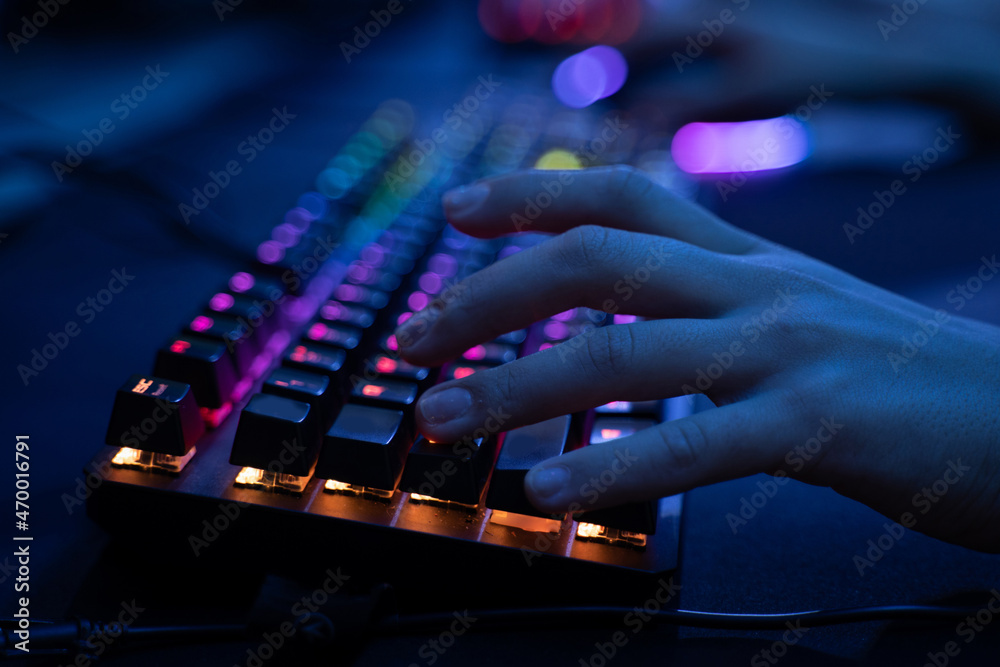 Cyber sport gamer holding hand at the computer keyboard while playing ...