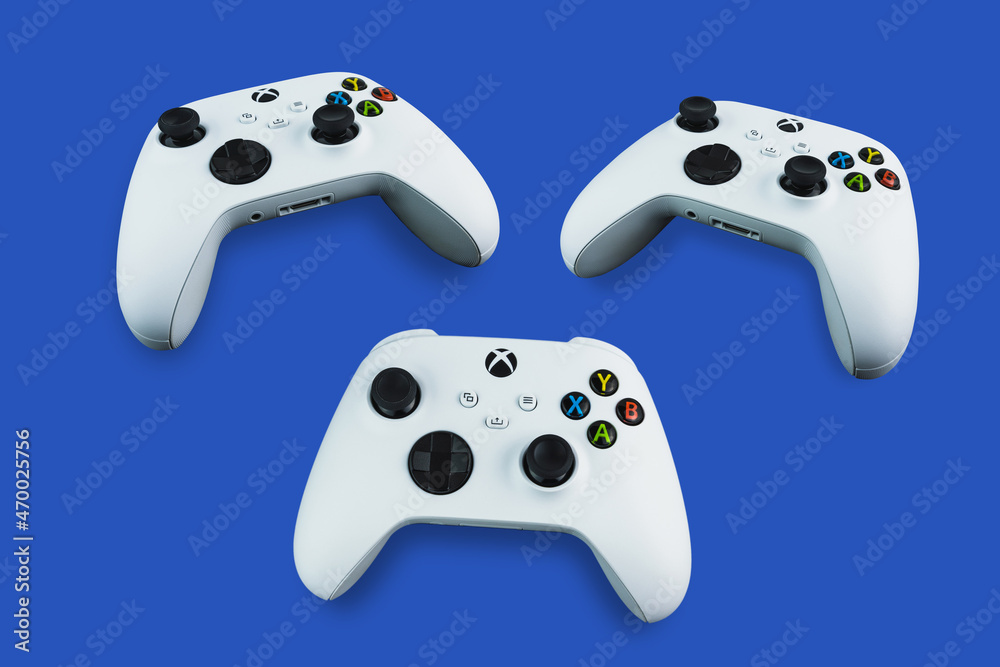 Xbox Series S Robot White Controllers in 3 different positions on blue ...