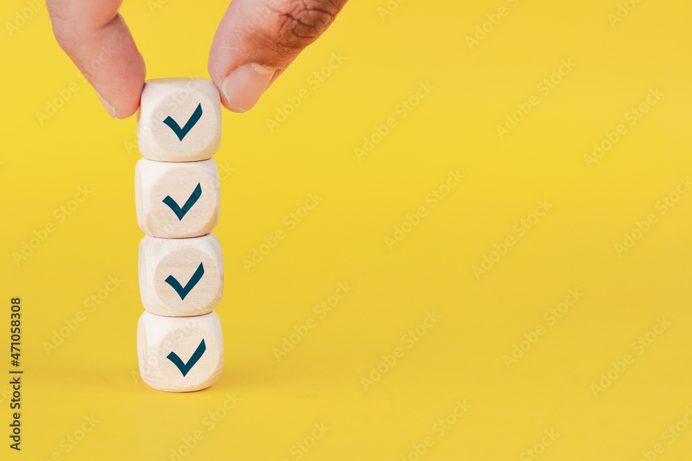 Check mark on wooden cube, checklist concept Stock Photo | Adobe Stock