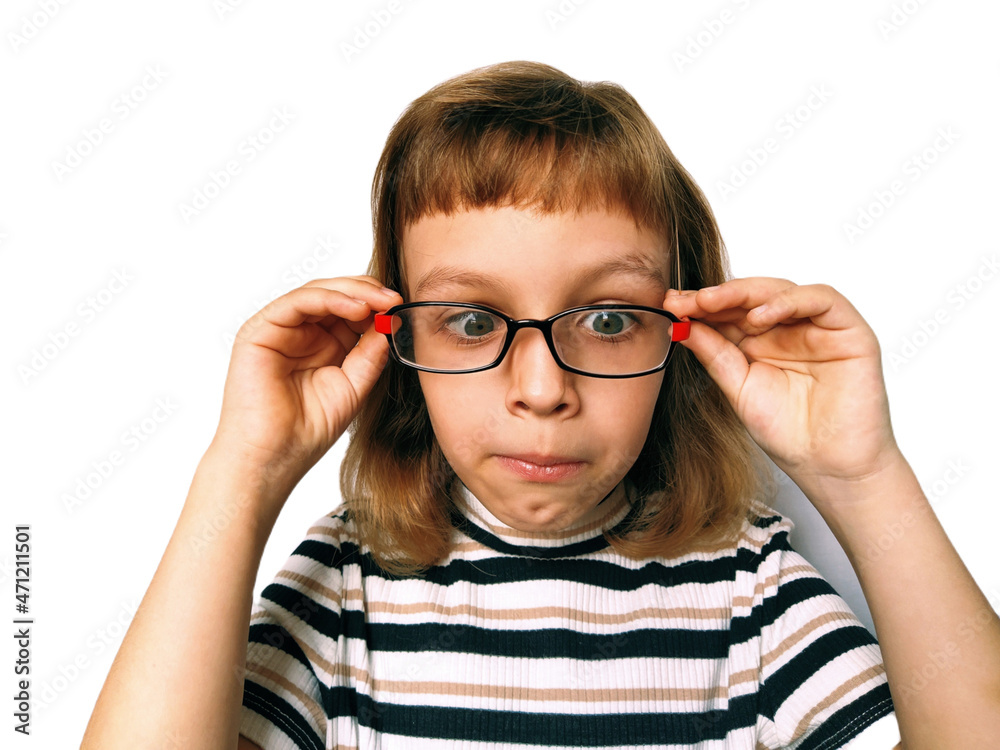 Cute 7 year old Caucasian girl looks into glasses. Eyes in a bunch ...