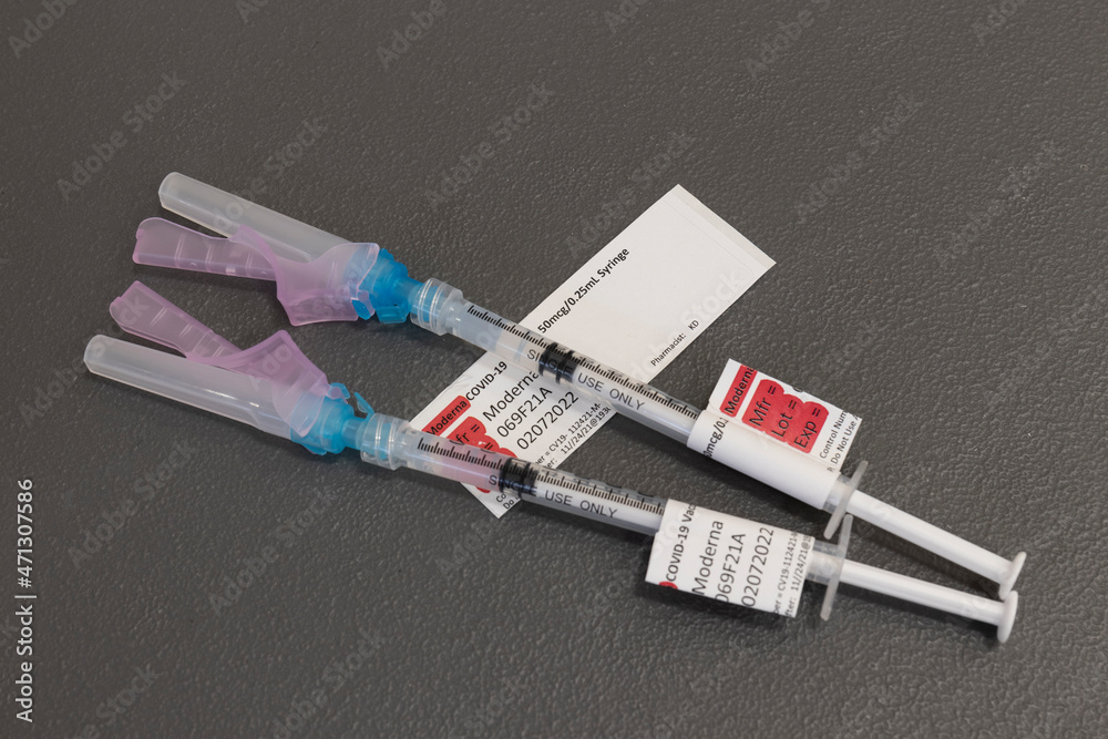 Fotografie Moderna COVID-19 Vaccination booster syringes or hypodermic ...