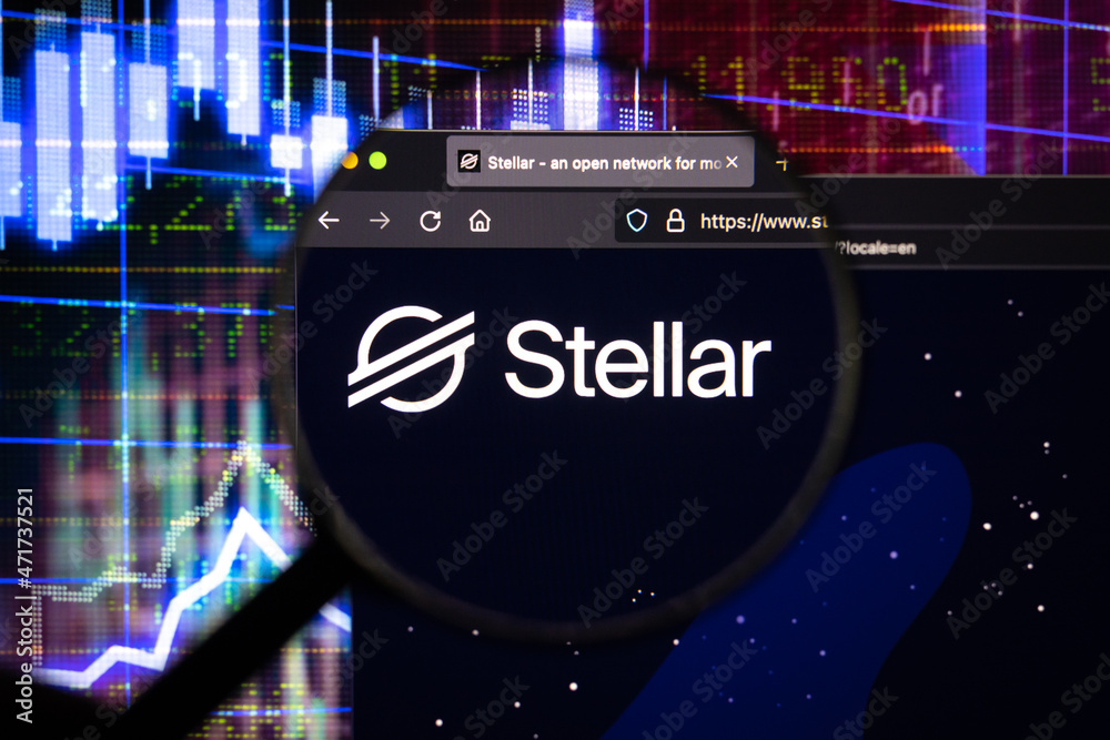 Stellar lumen company logo on a website, seen on a computer screen through a magnifying glass ...