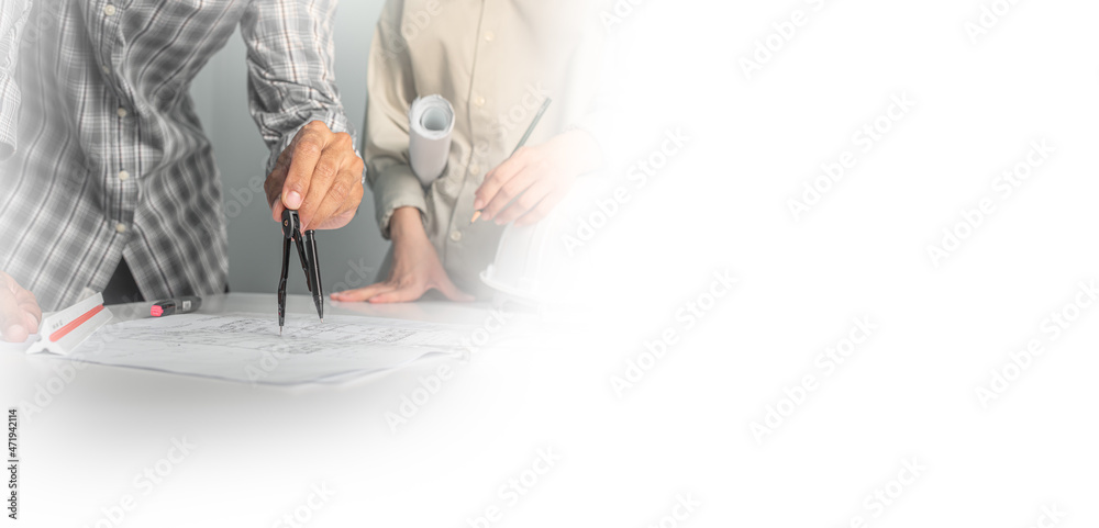 Architect working on blueprint with copy space. Architects workplace ...