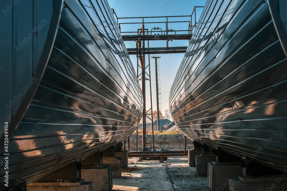Two overground storage tanks for bitumen. View from inside. Bitumen is ...