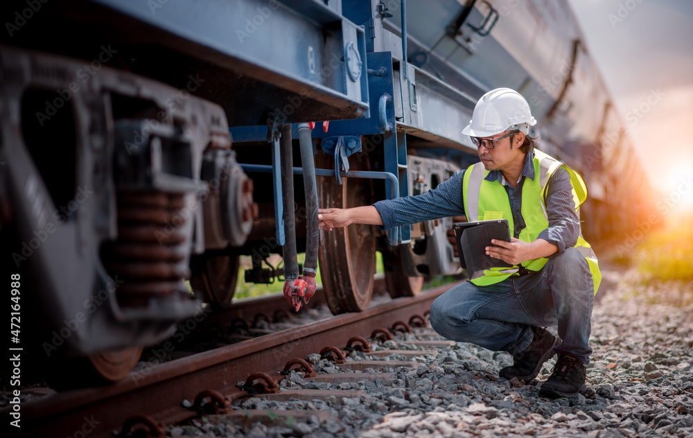 Engineer under inspection and checking construction process railway ...