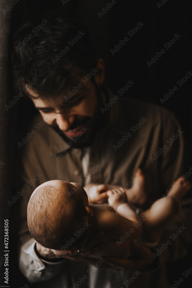 Caucasian father kissing newborn baby. Parent holding rocking child ...