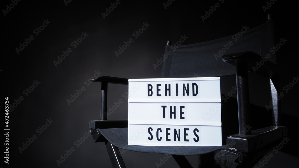 Director chair with behind the scene banner light box. Letterboard text ...
