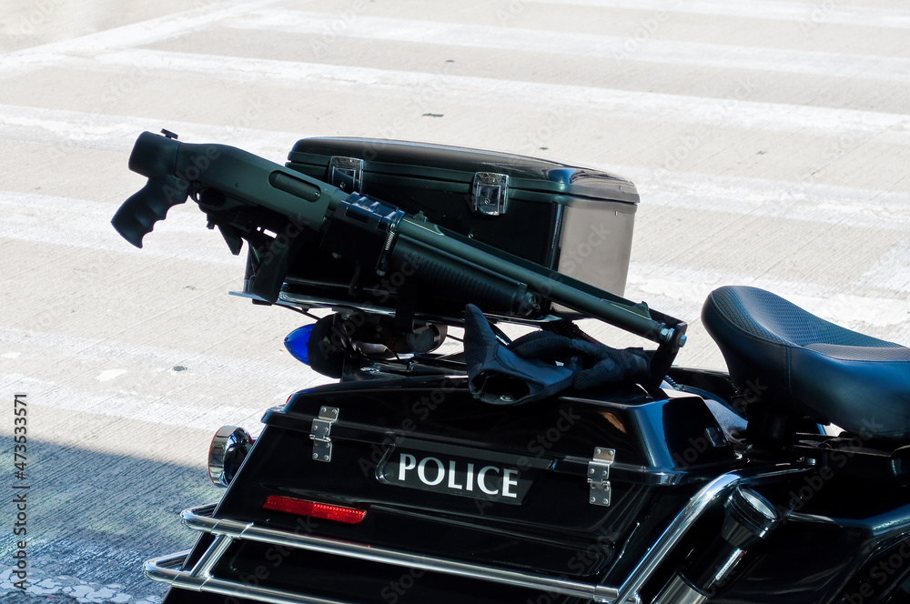 police motorcycle with guns parked on the street Stock Photo | Adobe Stock
