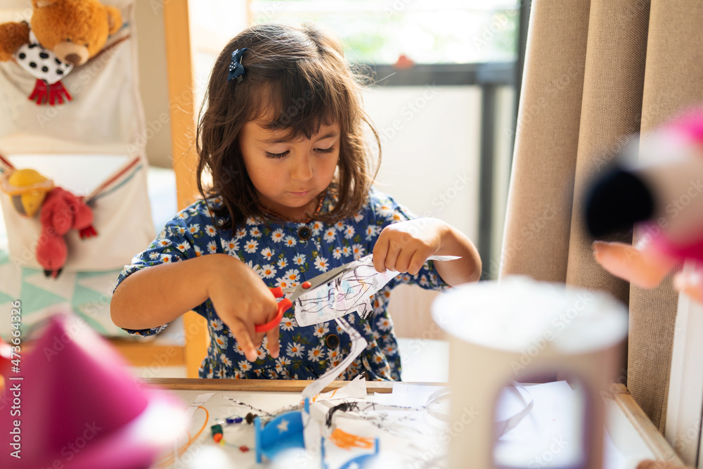 Little girl doing crafts Stock Photo | Adobe Stock