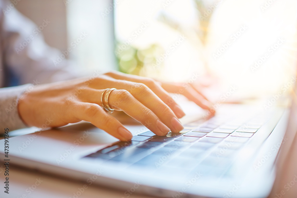 Foto de Stock Cropped female freelancer typing content text on laptop keyboard using wireless ...