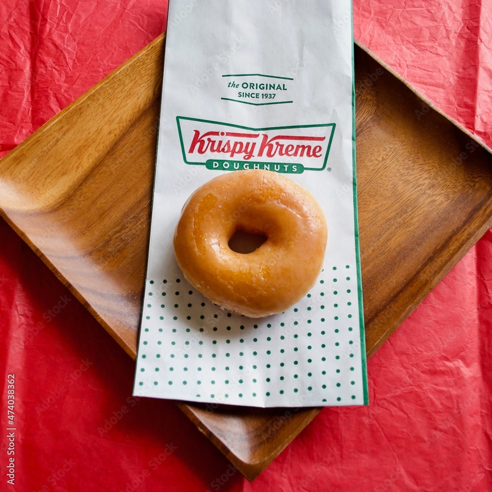 Stock-Foto „A Krispy Kreme Original Glazed doughnut with Krispy Kreme ...