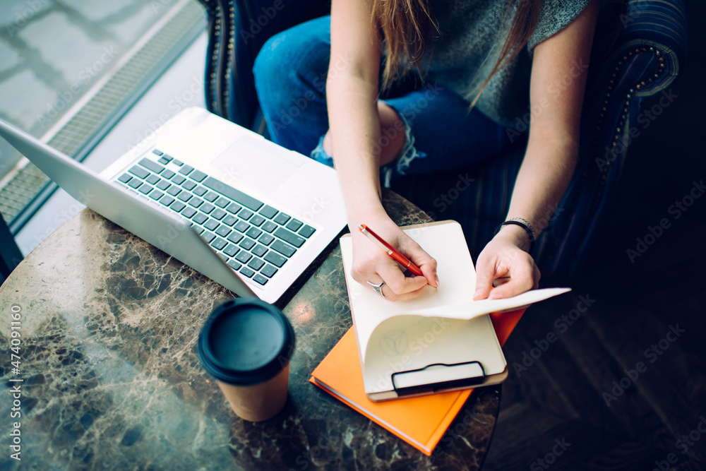 Unrecognizable woman taking notes on clipboard Stock Photo | Adobe Stock