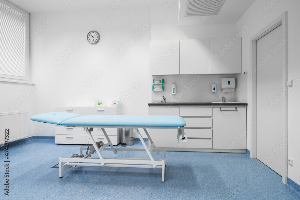 Clean and comfortable room in the hospital with examination table ...