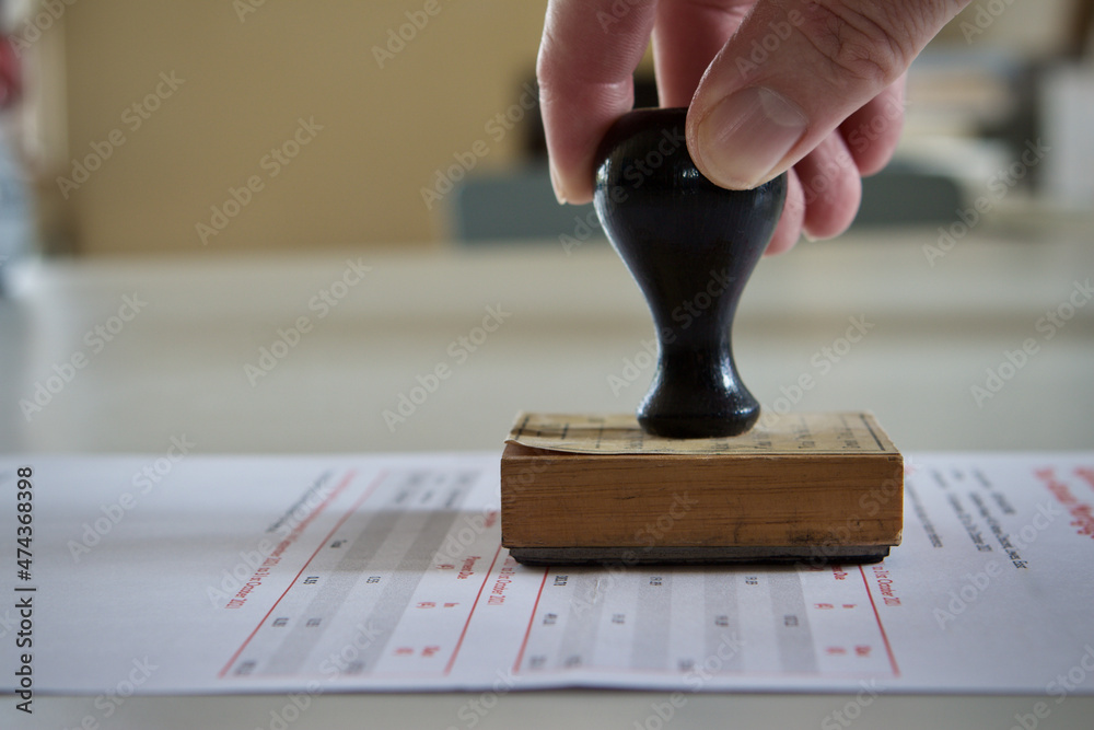 Document being rubber stamped Stock Photo | Adobe Stock