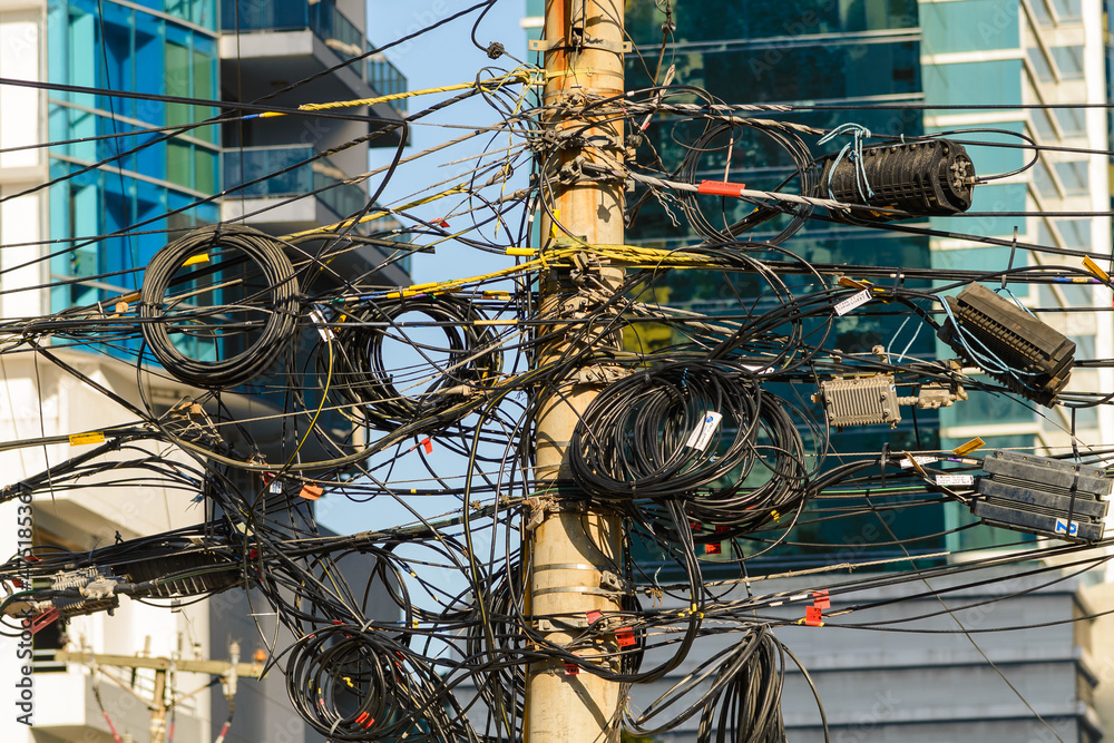 network of fiber optic cables installed on a utility pole Stock Photo ...