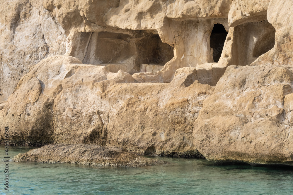 Stunning neolithic era caves on the cliff of Matala beach, Southern ...