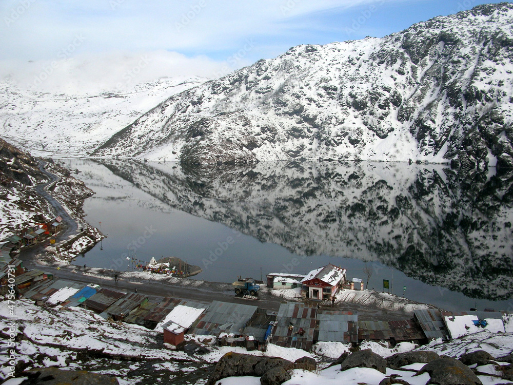 Snow covered terrain mirrored at Tsomgo Lake look mesmerizing situated ...