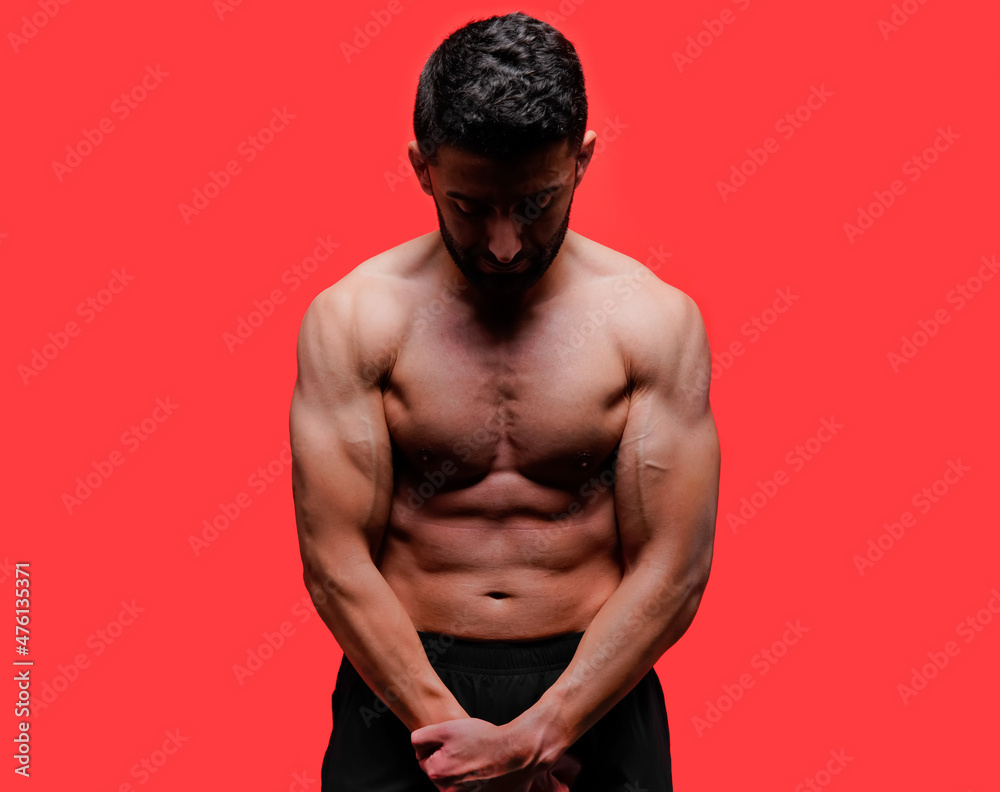Muscular strong male posing with his body. Bodybuilder flexing arms and ...