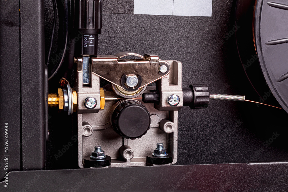 dark background. the device is equipped with a unit for welding metal ...