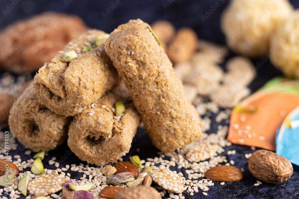 Winter delicacy Indian traditional sweet mithai with kites for Makar ...