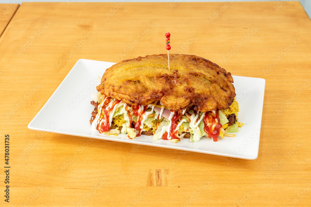 Foto The Venezuelan patacón is flattened and fried green plantain, very ...