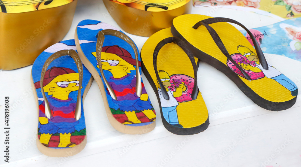 Flip flops with the characters of The Simpsons. Homer and Lisa Simpson ...