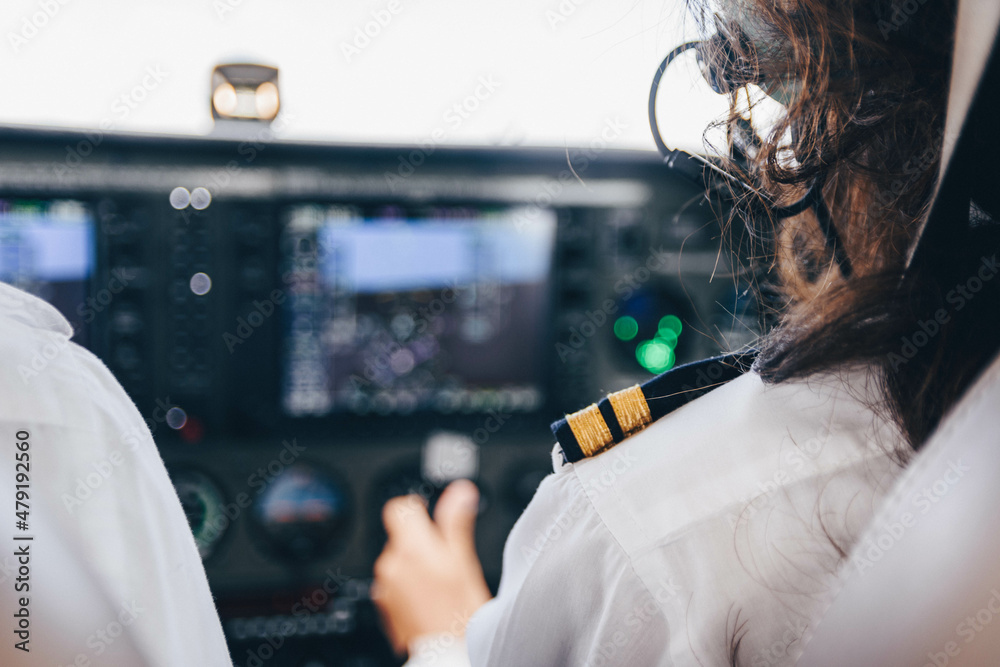 Inside view of the cockpit of an unrecognizable female student pilot ...