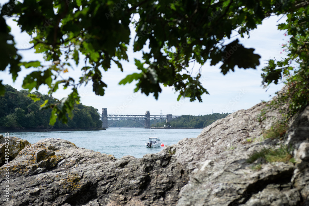Pont Britannia Bridge, Anglesey, Wales, UK - Small leisure boat on the ...
