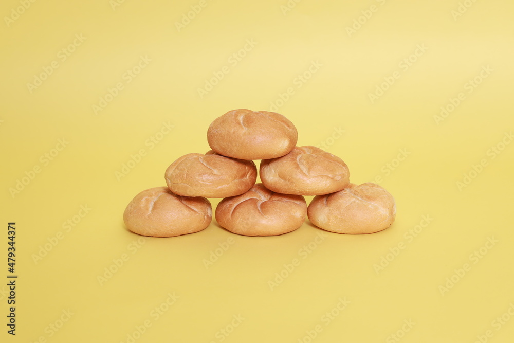 pyramid of buns on the yellow background Stock Photo | Adobe Stock