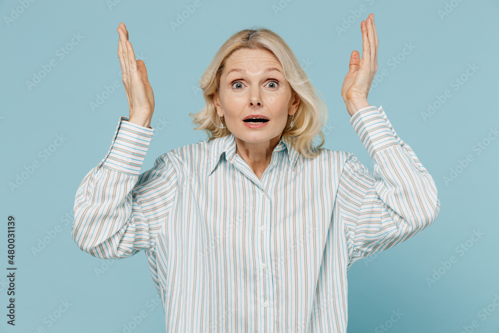 Elderly angry shocked indignant caucasian woman 50s wear striped shirt ...