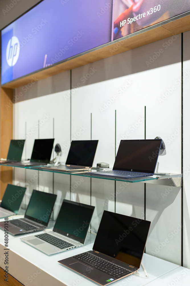 New HP notebook computers shown on shelves in electronic store, brand ...