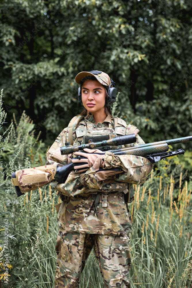 Caucasian Military lady woman in tactical gear posing for photo in ...