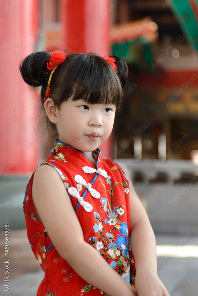 Little Asian girl in Chinese traditional dress to celebrate Chinese New ...