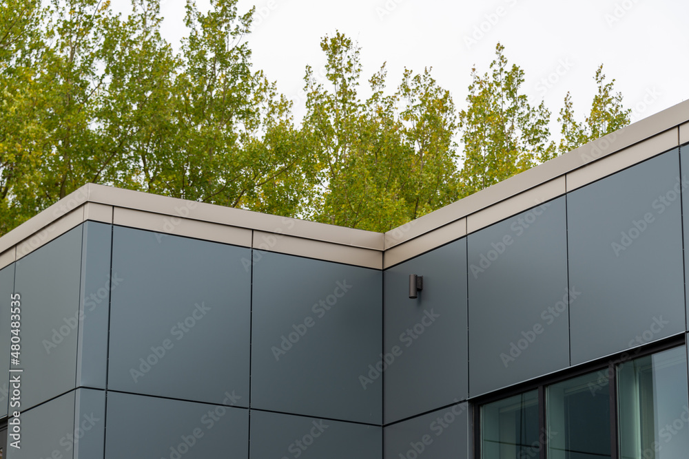 The exterior wall of a contemporary commercial style building with ...