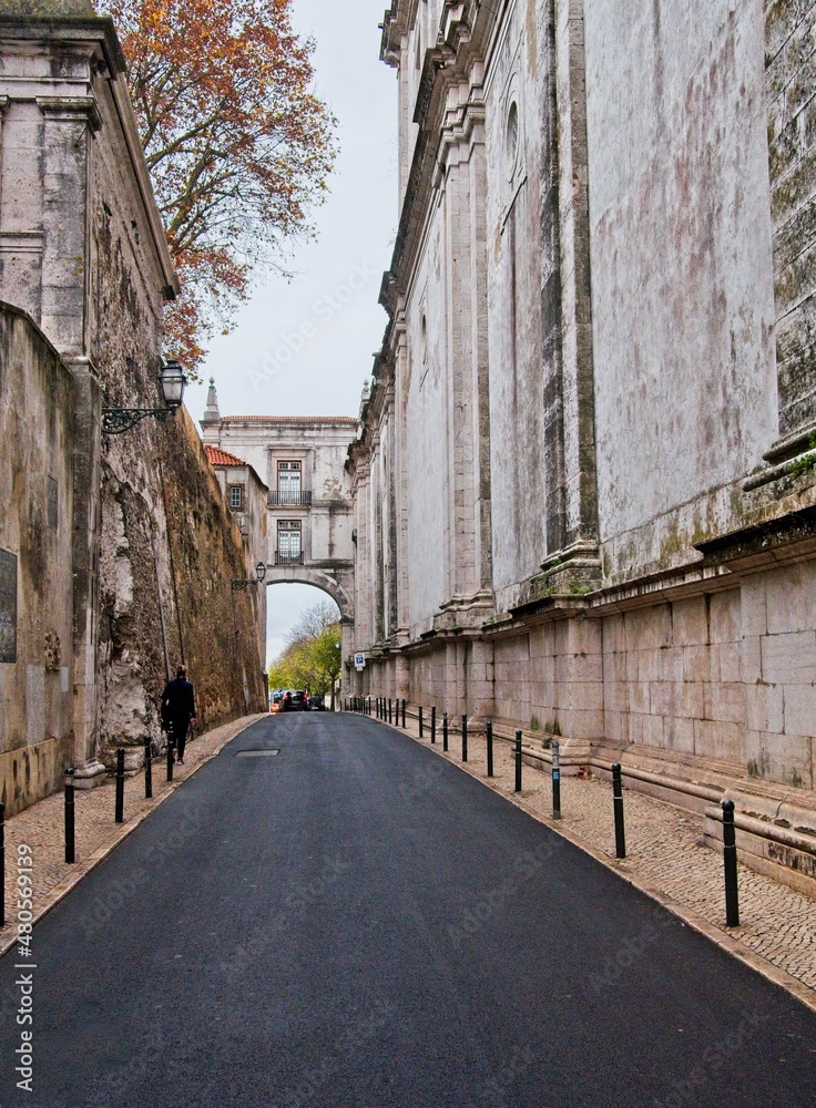Vertical narrow road with pedestrian bridge connecting divided ...