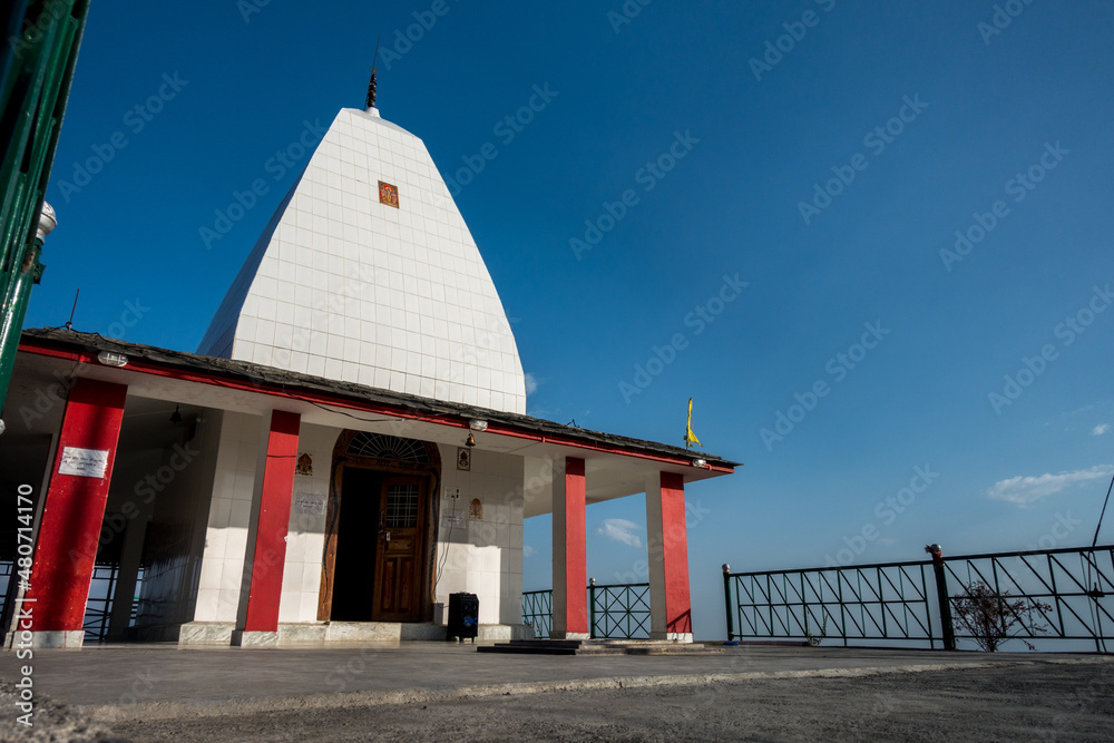 A wide angle shot of a temple in north India dedicated to NAG DEVTA ...