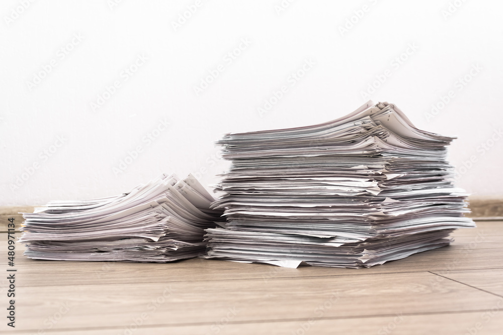 bundles bales of paper documents. stacks packs pile on the desk in the ...