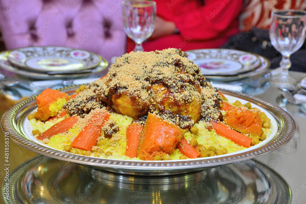 Moroccan couscous with chicken, red squash, carrots and chickpeas. The ...