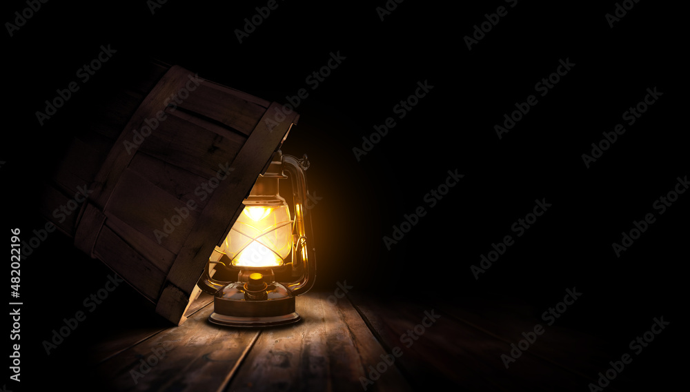 Lighted lamp under a bushel basket. Biblical parable theme concept. Stock Photo | Adobe Stock