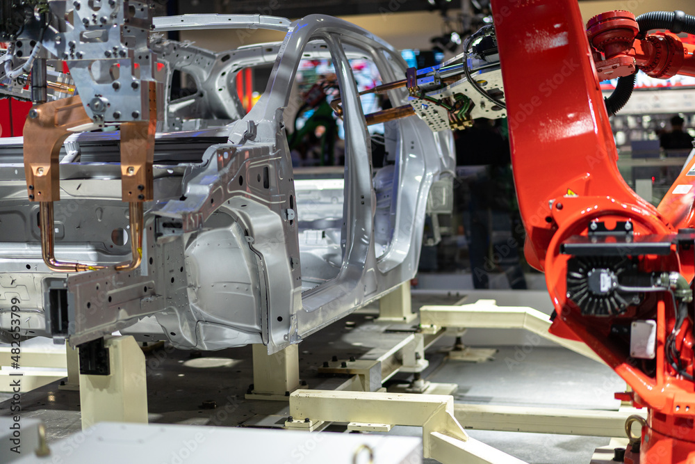 Robot arm working in car factory Stock Photo | Adobe Stock