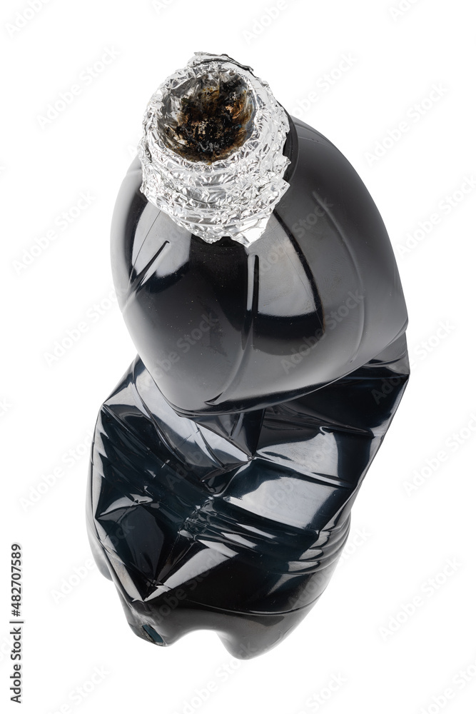 marijuana bong made from a plastic bottle and foil isolated on white ...