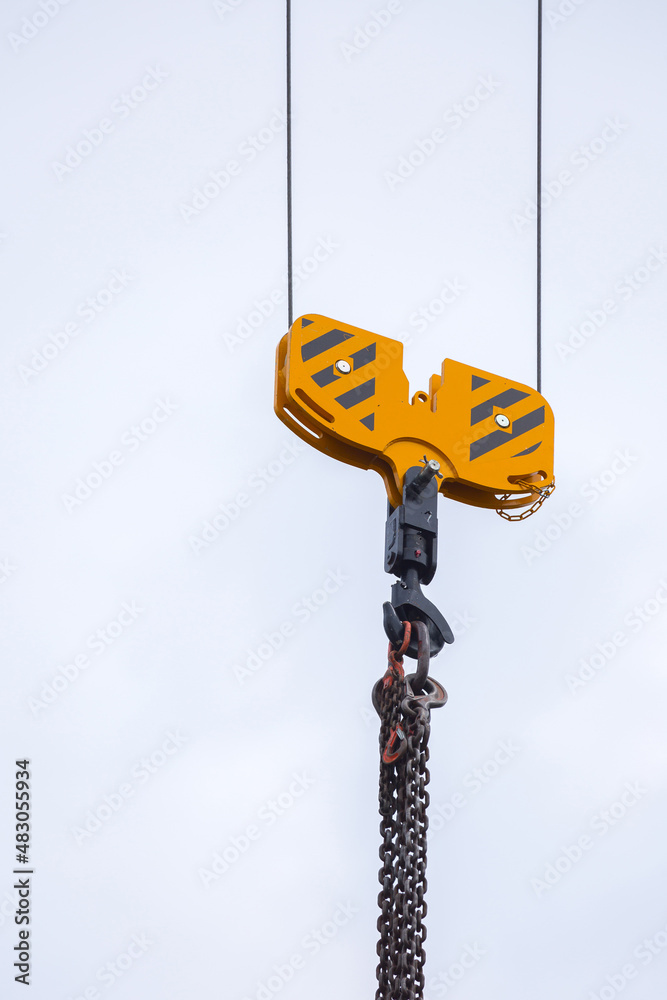 Crane hoisting block with hook on steel chain on the steel rope ...